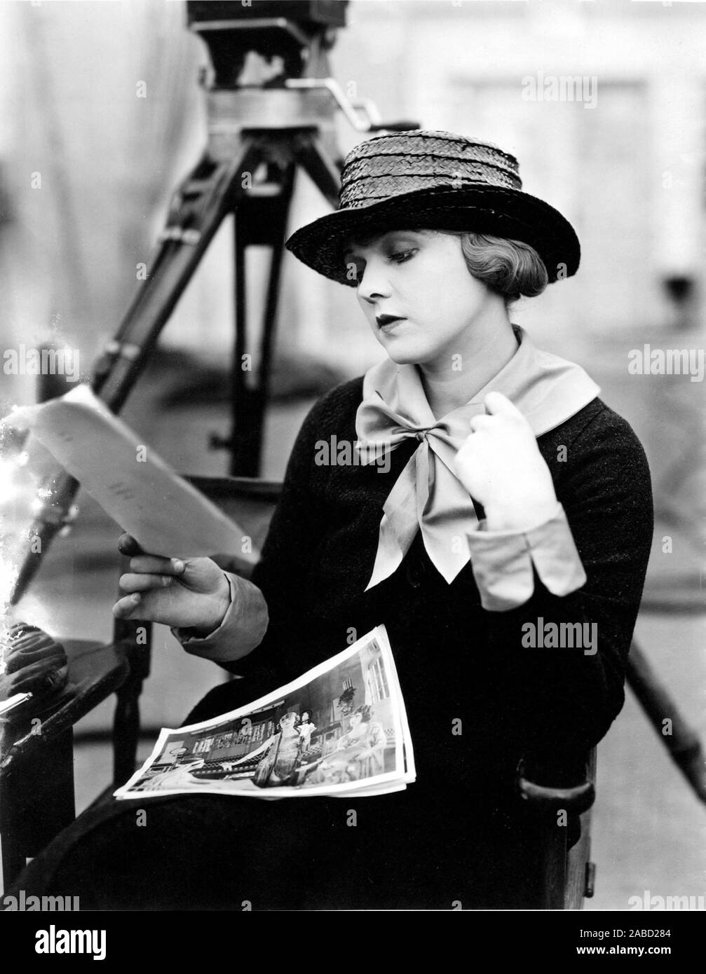 MISS HOBBS, Wanda Hawley, going over promotional stills on-set, 1920 ...