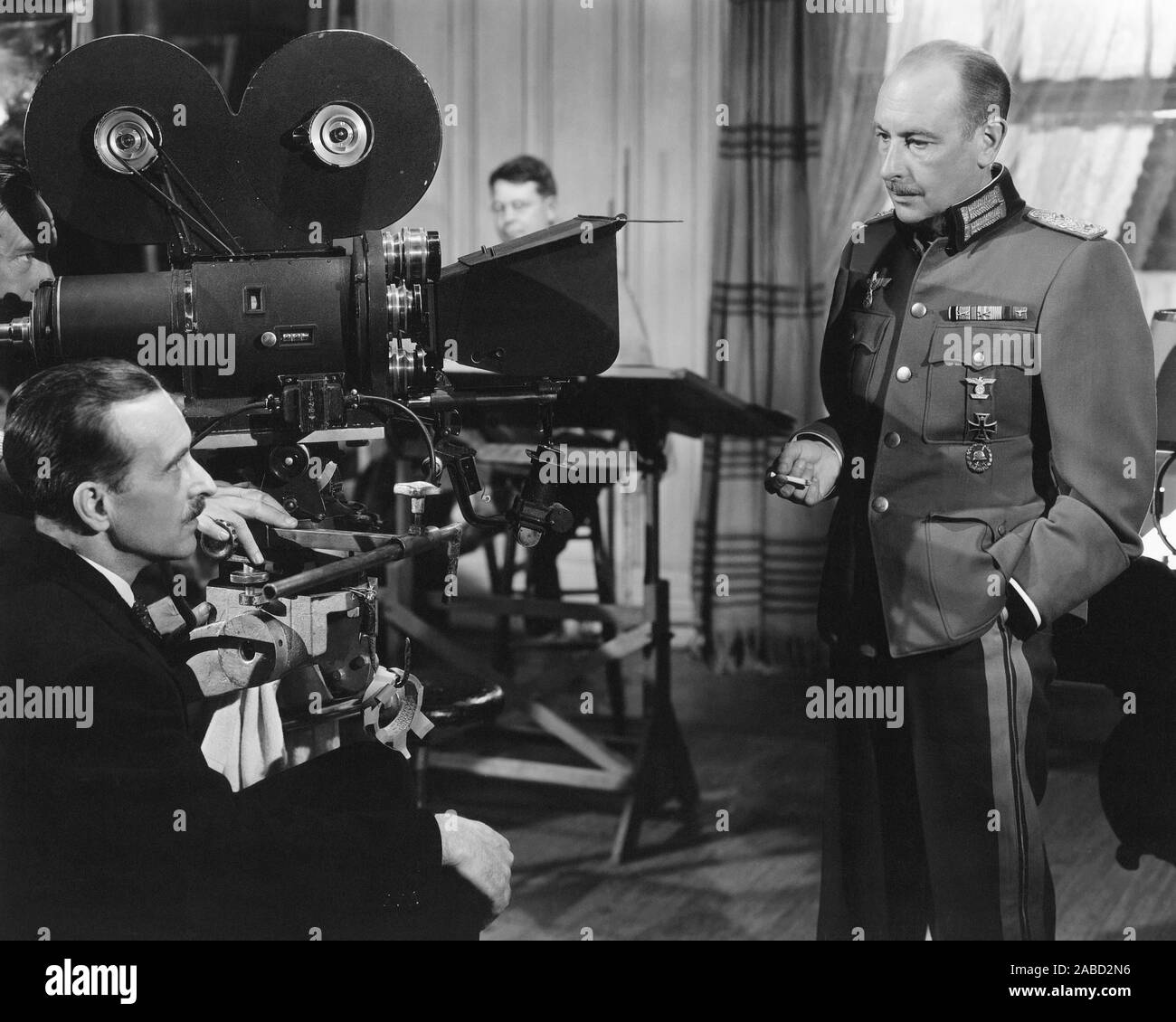 THE MOON IS DOWN, from left: E.J. Ballantine, Cedric Hardwicke on set ...