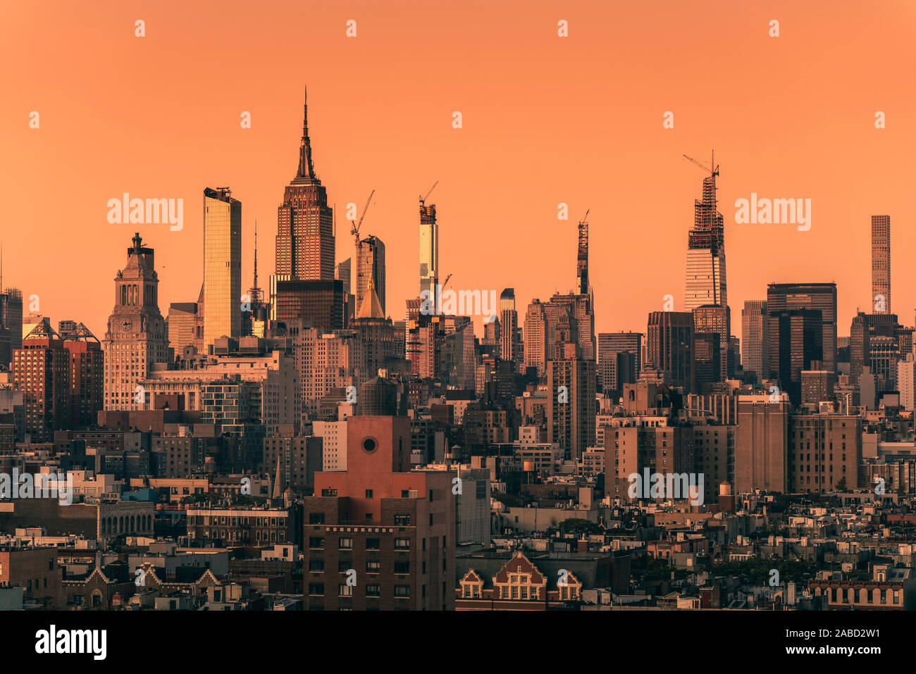 Sunset above Manhattan skyscrapers, New York City. Light effect applied ...