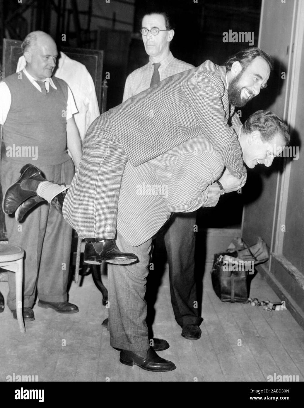 MOULIN ROUGE, Jose Ferrer, strapped into his false legs, rides piggy ...