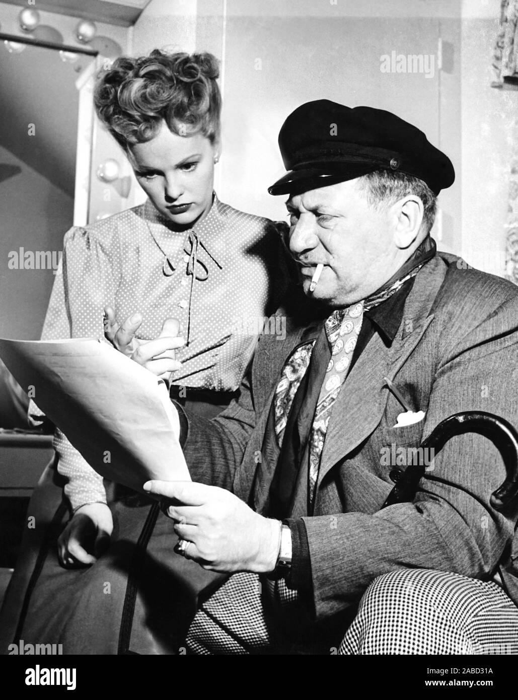 MOSS ROSE, from left: Peggy Cummins, director Gregory Ratoff on set ...