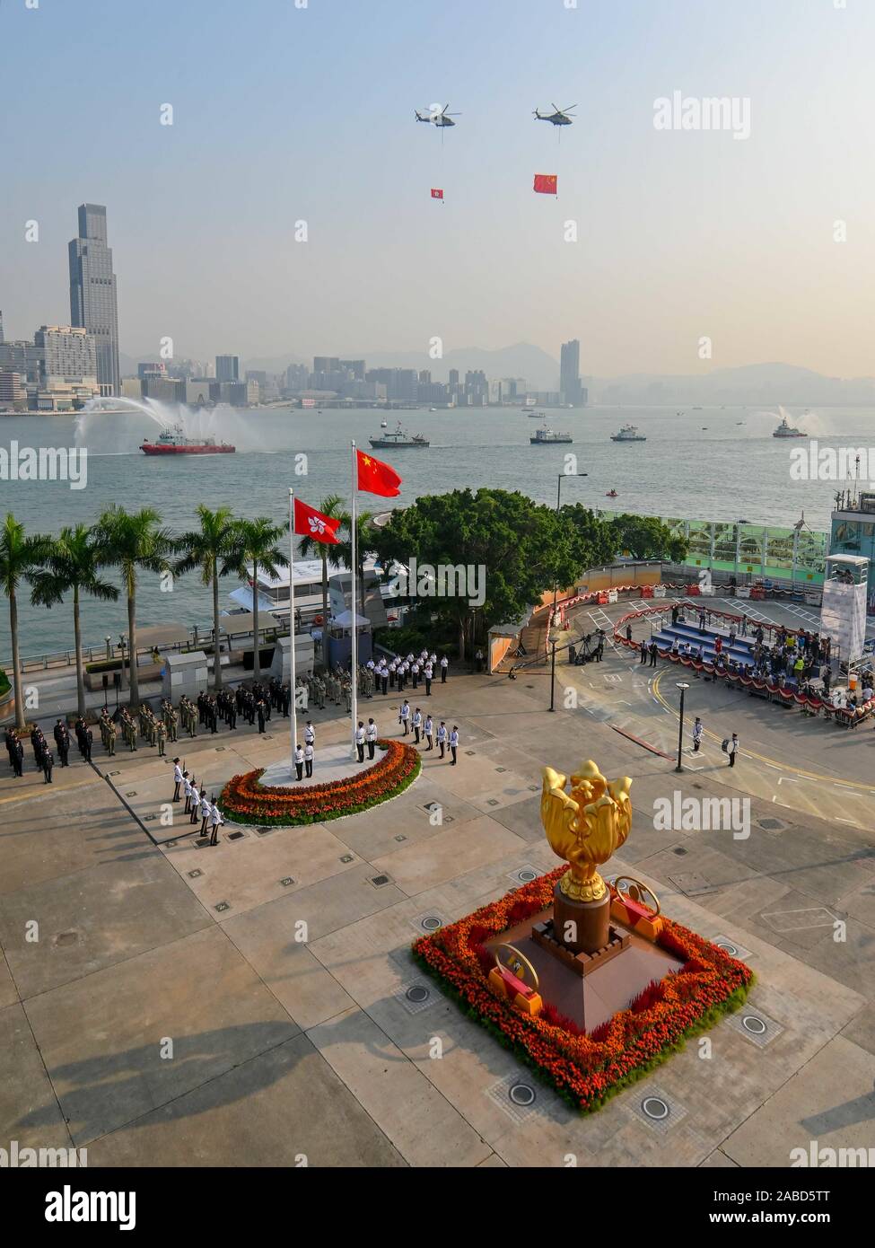 A national flag raising ceremony is held at the Golden Bauhinia Square ...