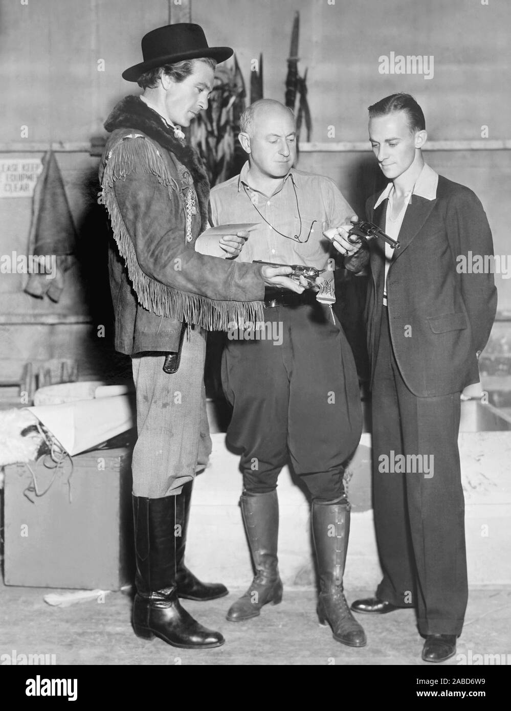 THE PLAINSMAN, from left: Gary Cooper, director Cecil B. DeMille ...