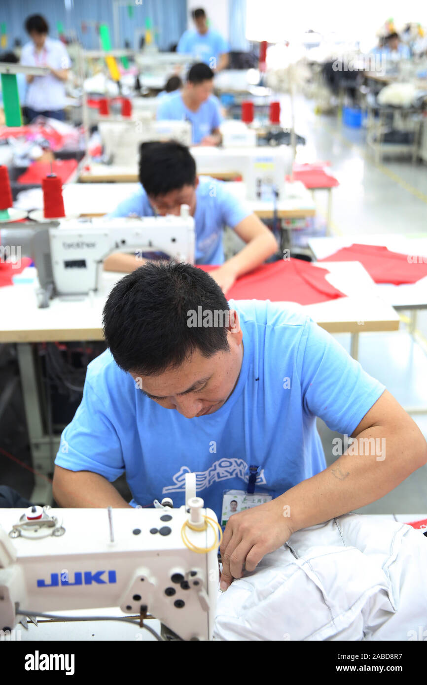 Workers make jackets at a factory of Bosideng, the leading Chinese down ...