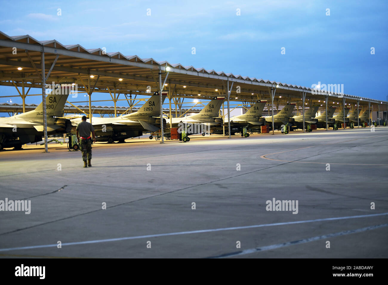 A member of the Air National Guard's 149th Fighter Wing walks across ...