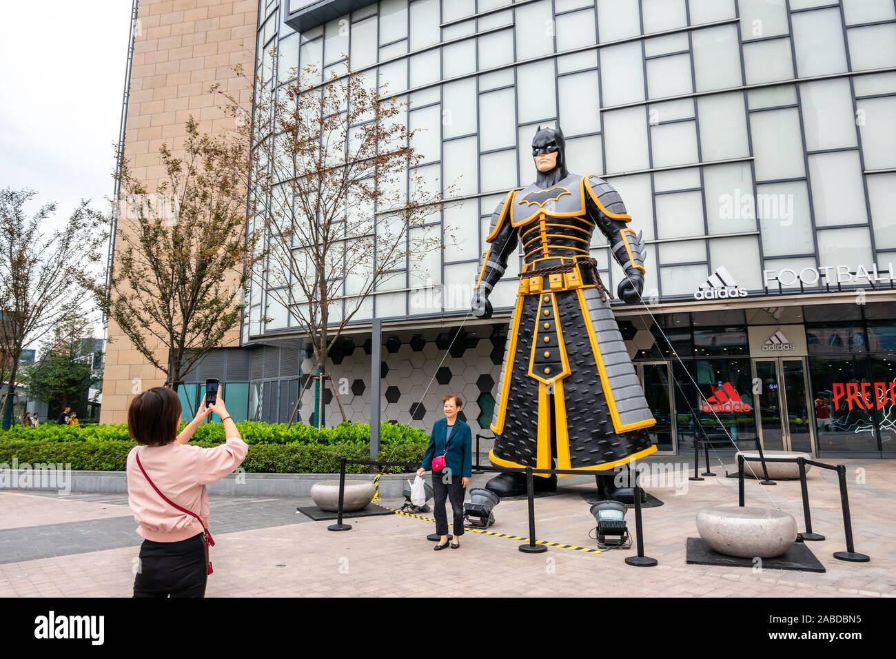 An eight-meter-high sculpture of fictional superhero Batman appears to ...