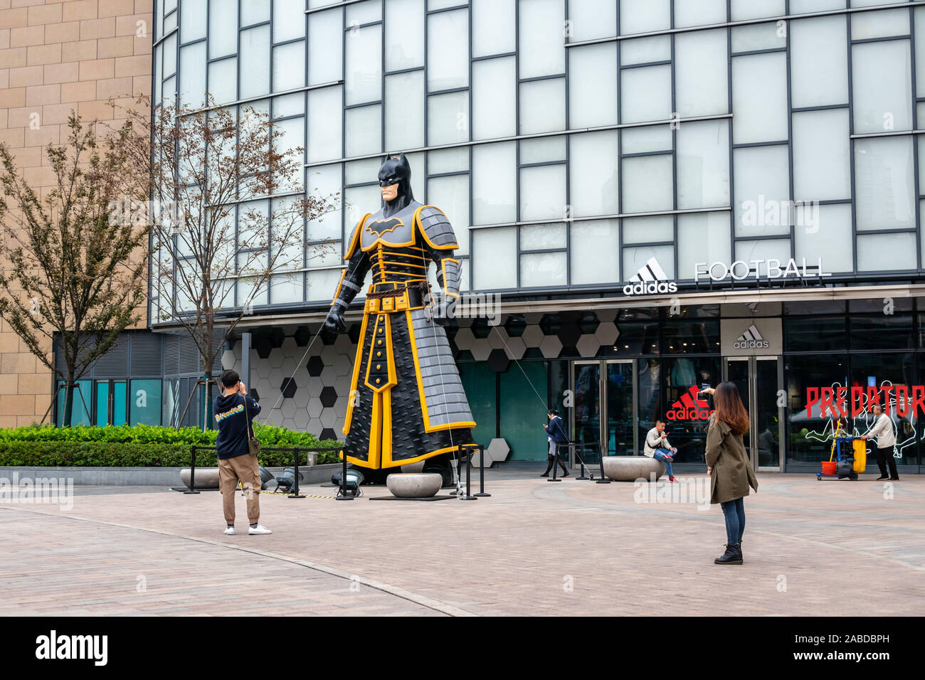 An eight-meter-high sculpture of fictional superhero Batman appears to ...
