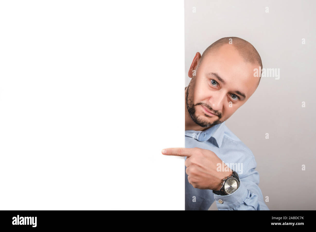 Man points to a place for the text Stock Photo - Alamy