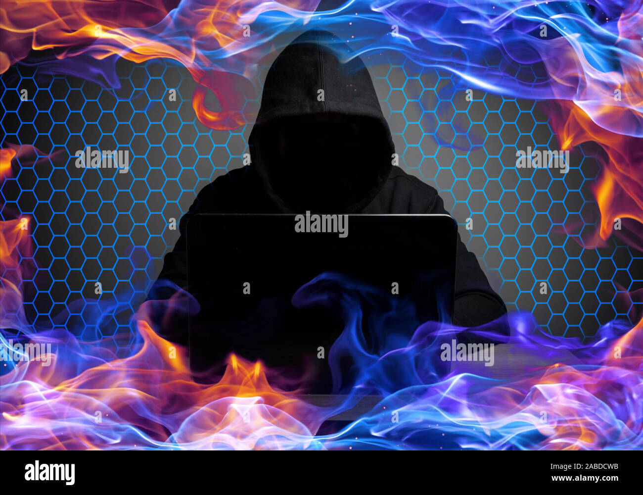 Abstract colorful smoky shot of a hacker in front of his computer with ...