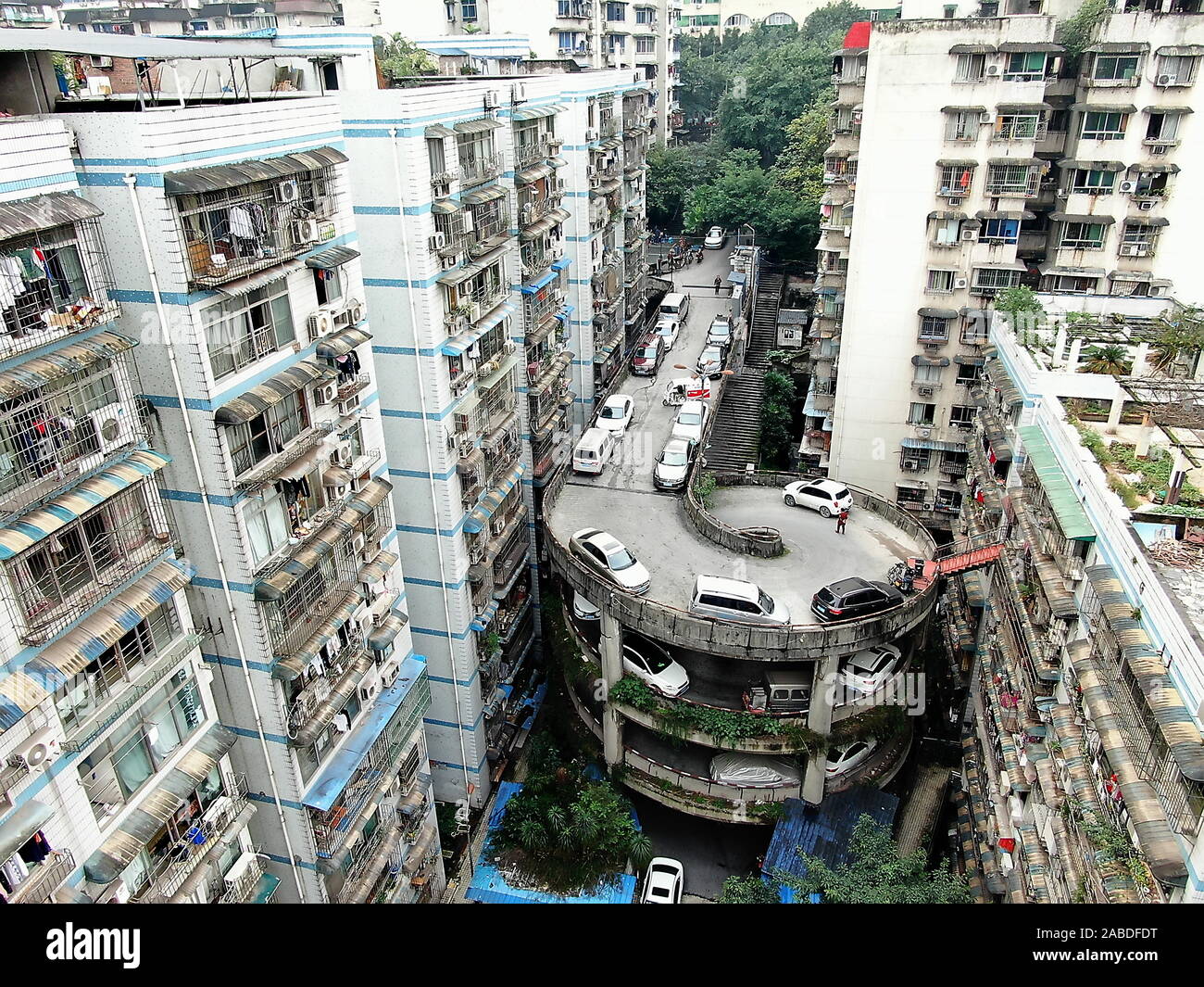 Aerial view of cars driving in the spiral parking lot in Chongqing ...