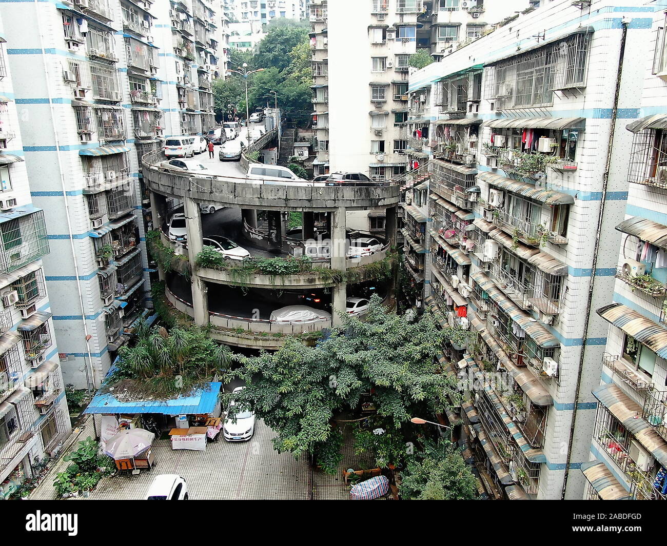 Aerial view of cars driving in the spiral parking lot in Chongqing ...