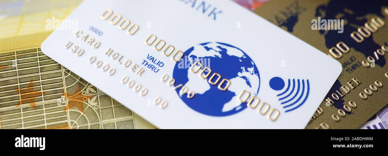 Cash and electronic money Stock Photo - Alamy