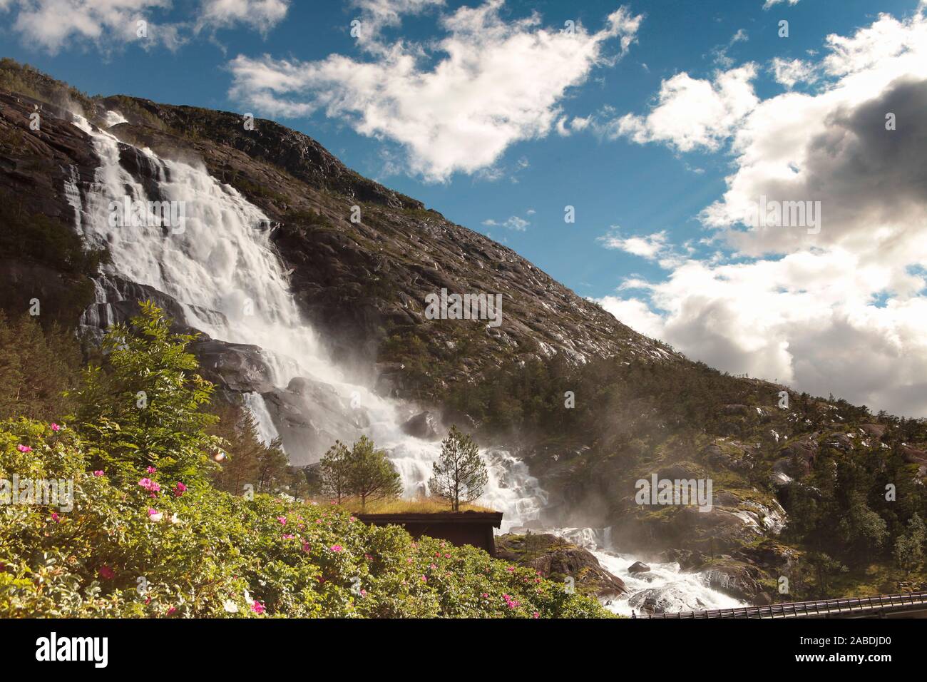 Waterfall Langfoss and power station. National tourist route. Famous ...