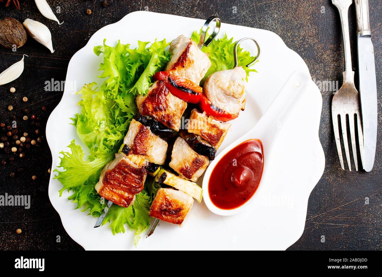 meat kebab with salad leaf and ketchup Stock Photo - Alamy