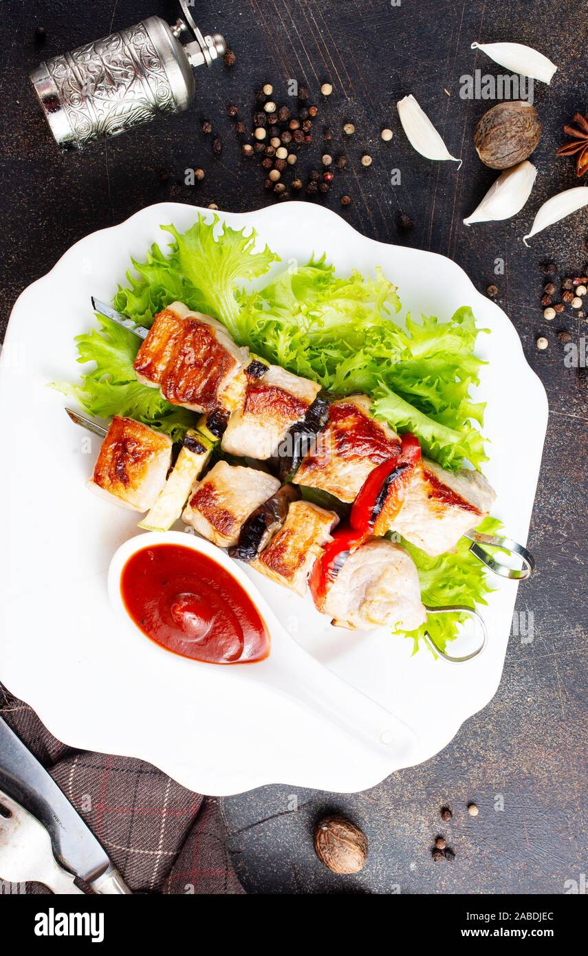 meat kebab with salad leaf and ketchup Stock Photo - Alamy