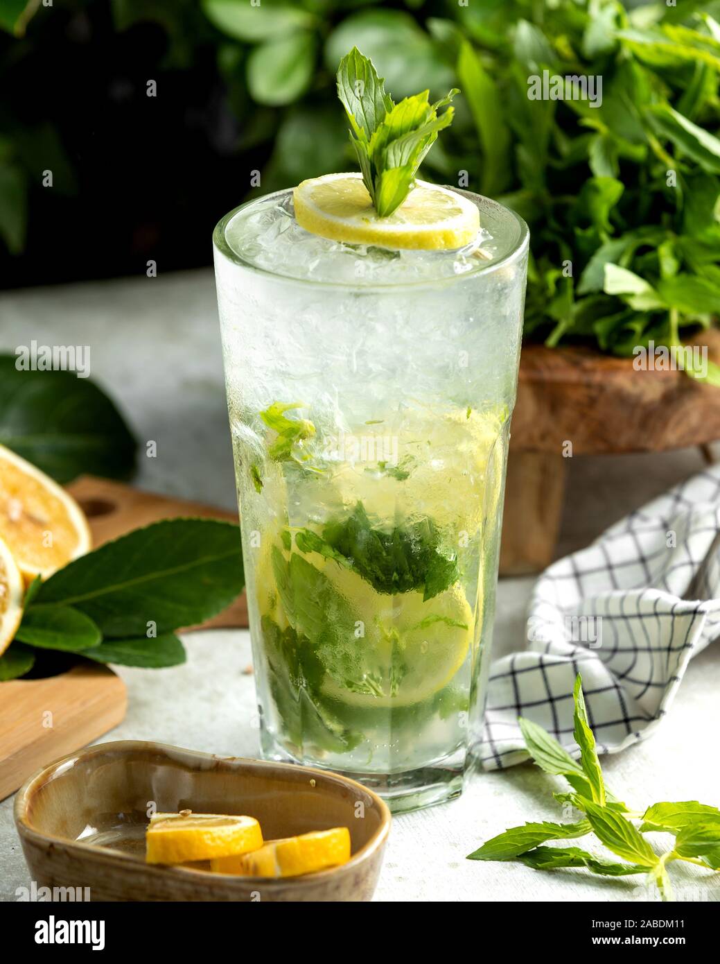 mojito glass garnished with lemon slice and mint leaves Stock Photo - Alamy