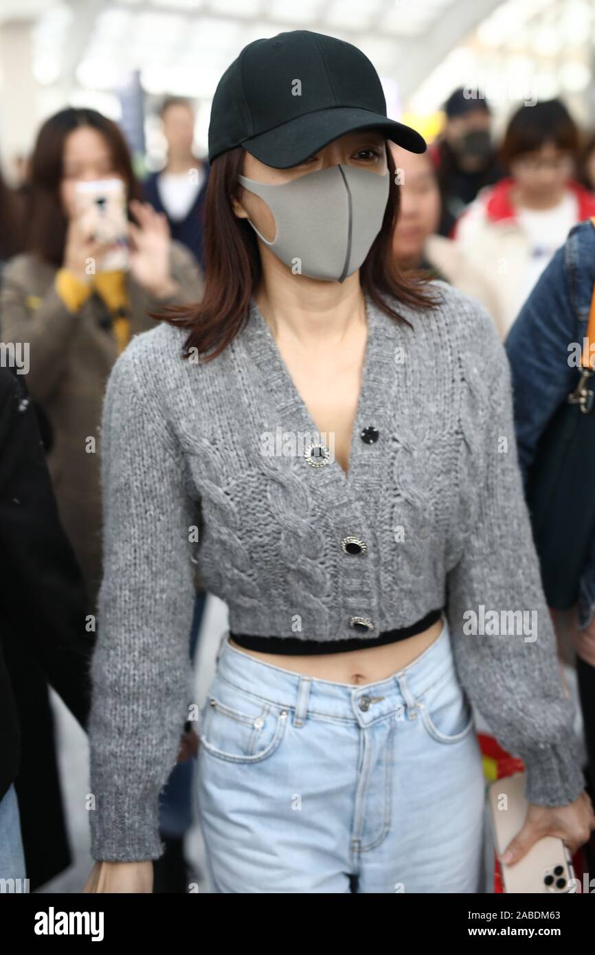 Chinese actress, model, and singer Qin Lan arrives at a Beijing airport ...
