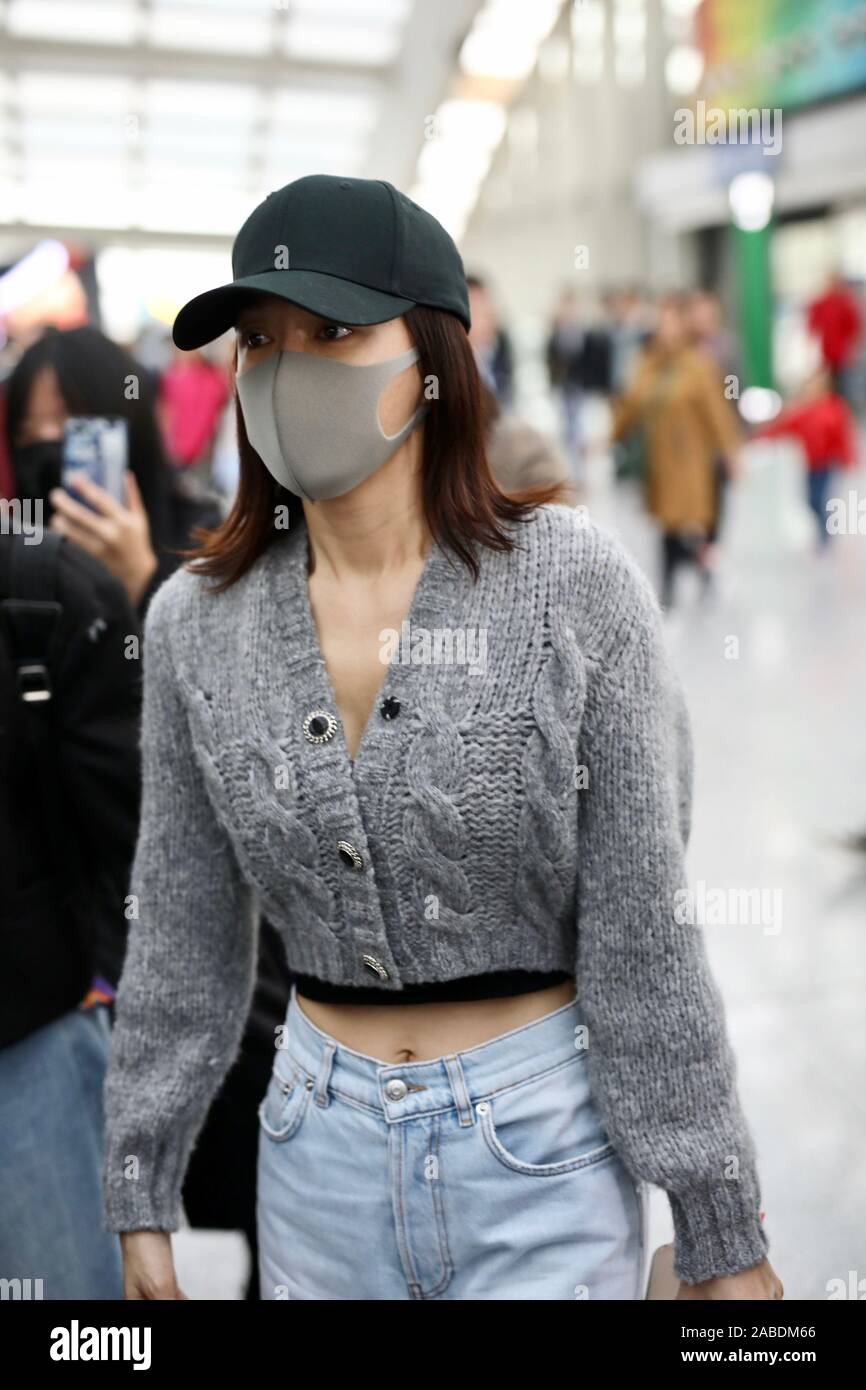 Chinese actress, model, and singer Qin Lan arrives at a Beijing airport ...