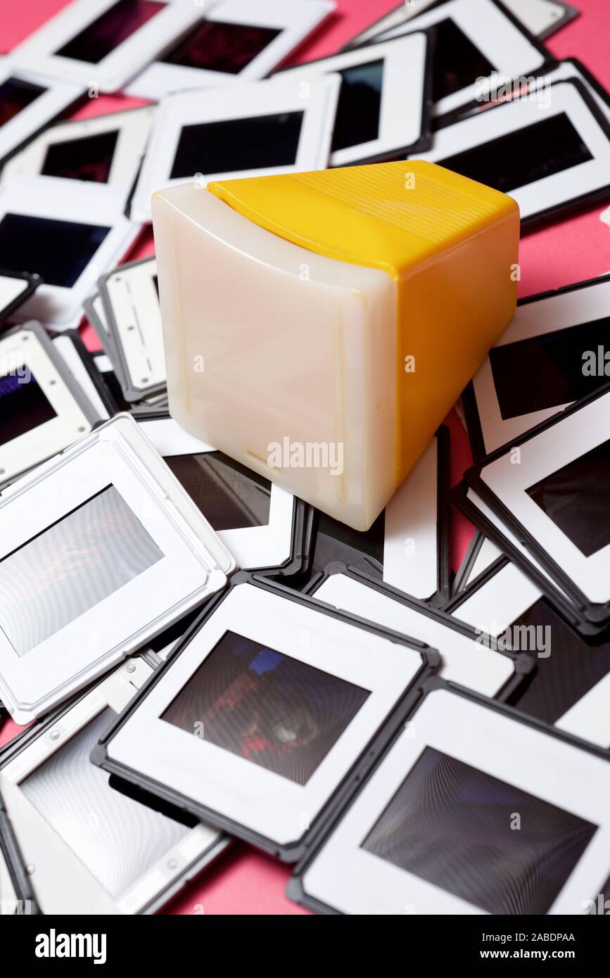 Slides and slide viewer on a pink table Stock Photo - Alamy