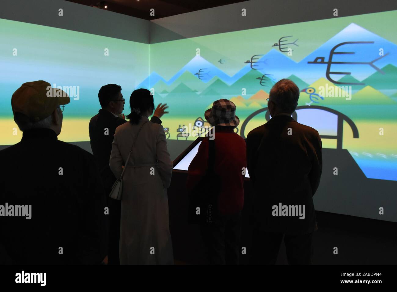 People take pictures of the oracle displayed through hologram in ...