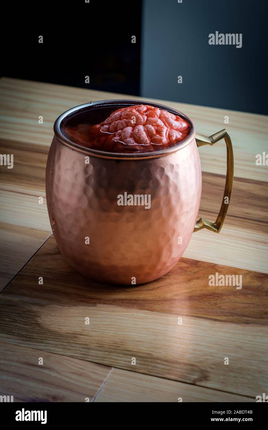 Human brain in moscow mule copper mug soaking for alcoholism addiction ...