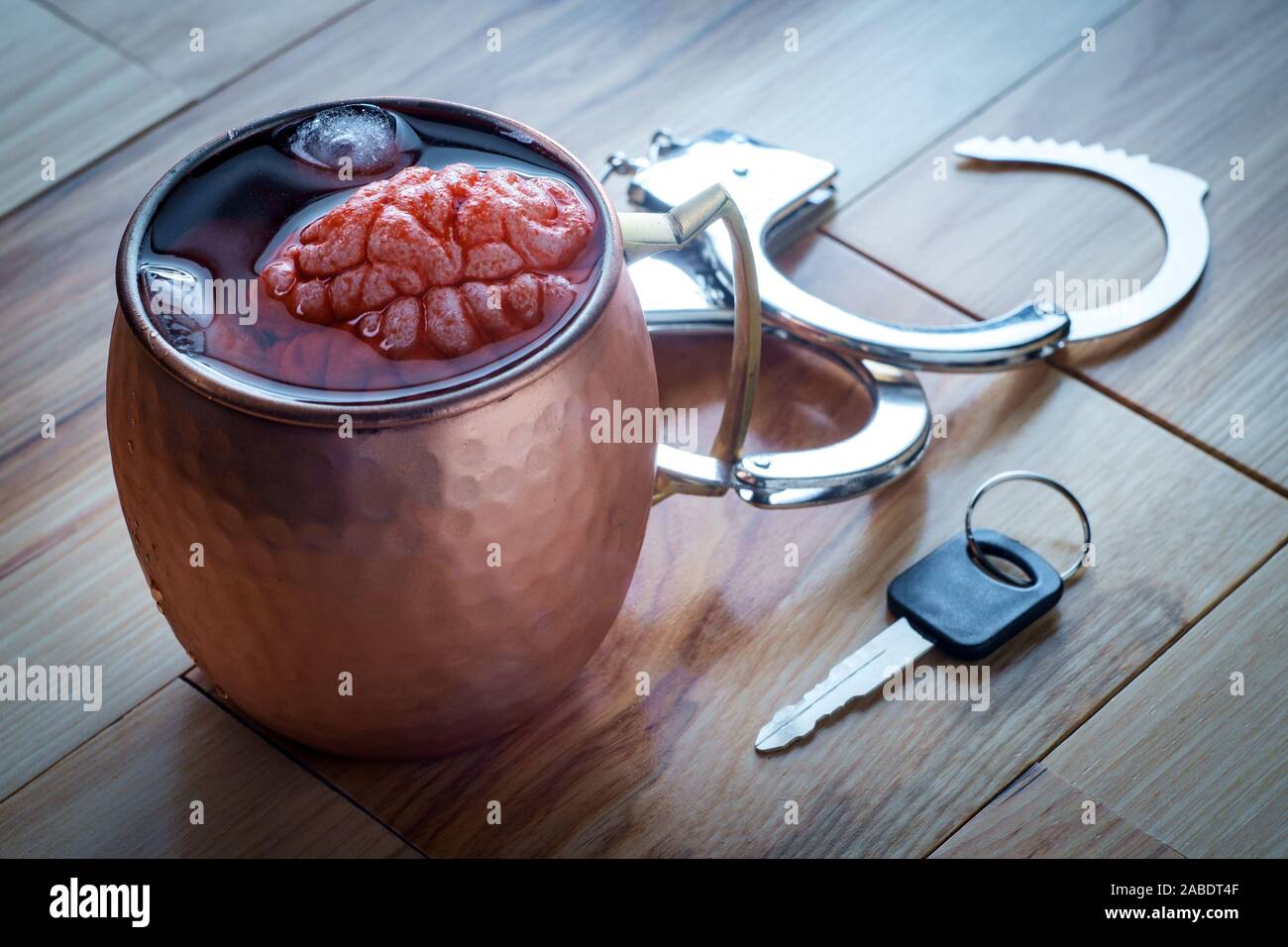 Human brain in copper Moscow mule cocktail mug soaking with car keys ...