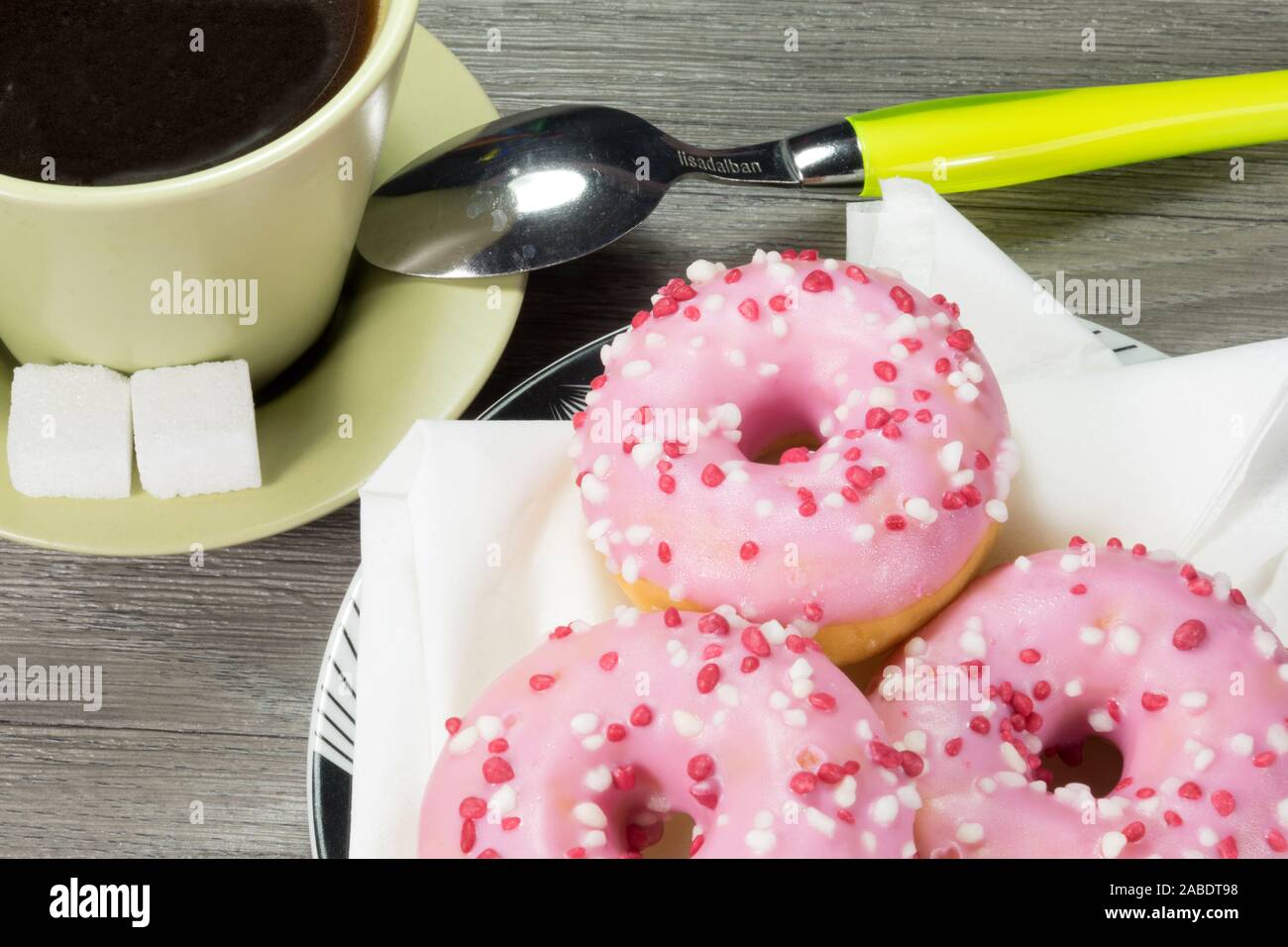 Coffee and donuts for breakfast Stock Photo - Alamy