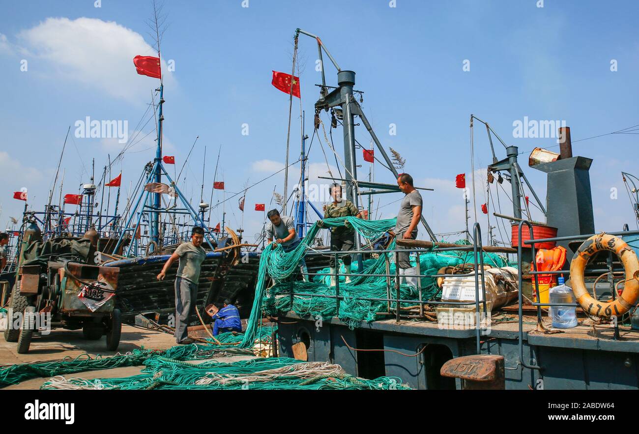 Fishing boats stop at Lanshan fishing port after catching enough ...