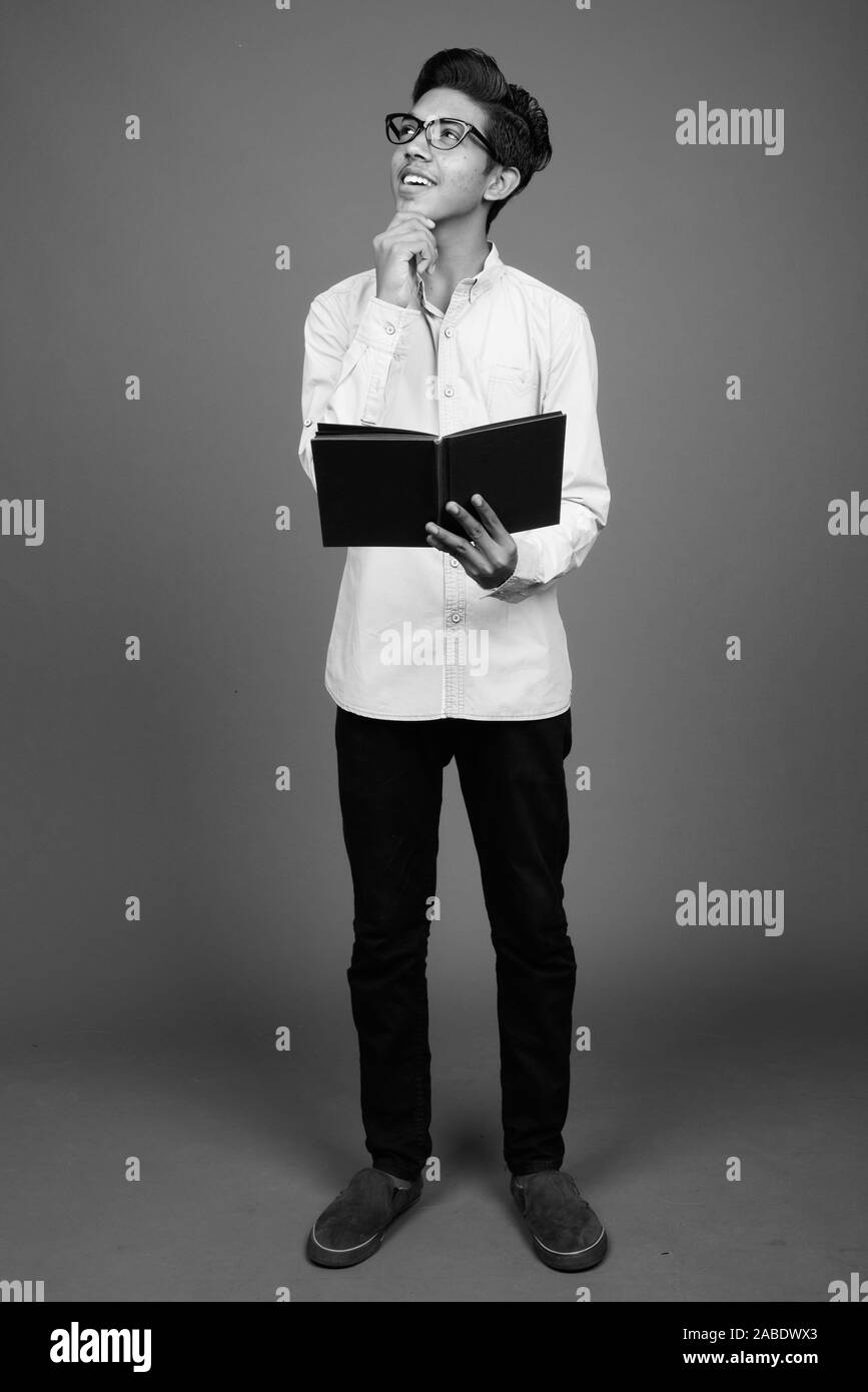 Young Indian boy looking smart in black and white Stock Photo - Alamy