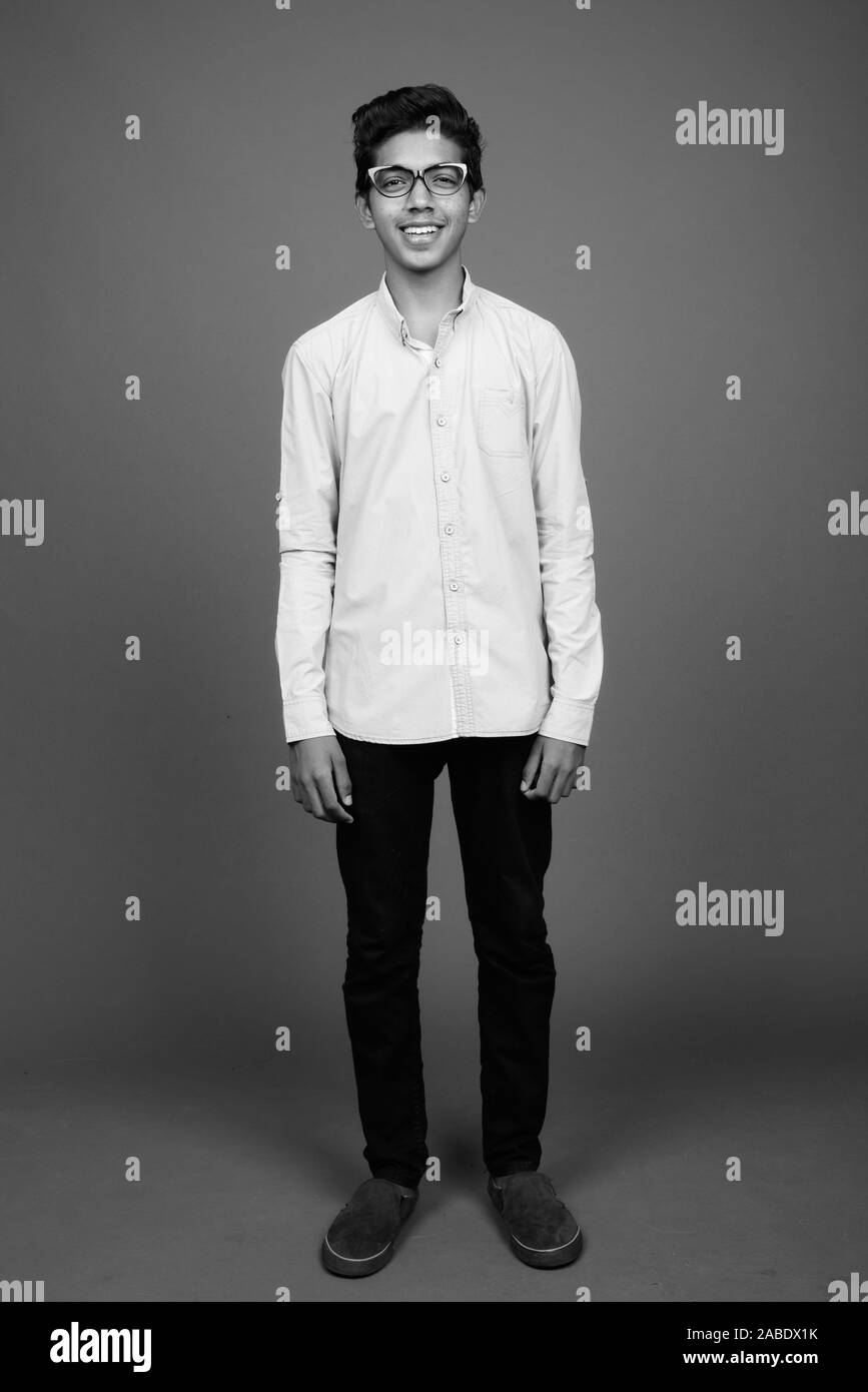Young Indian boy looking smart in black and white Stock Photo - Alamy