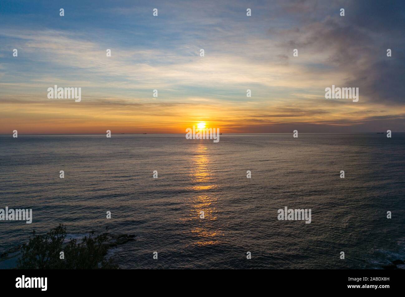 Sun with sunrays over ocean horizon. Sunrise, sunset seascape with ...