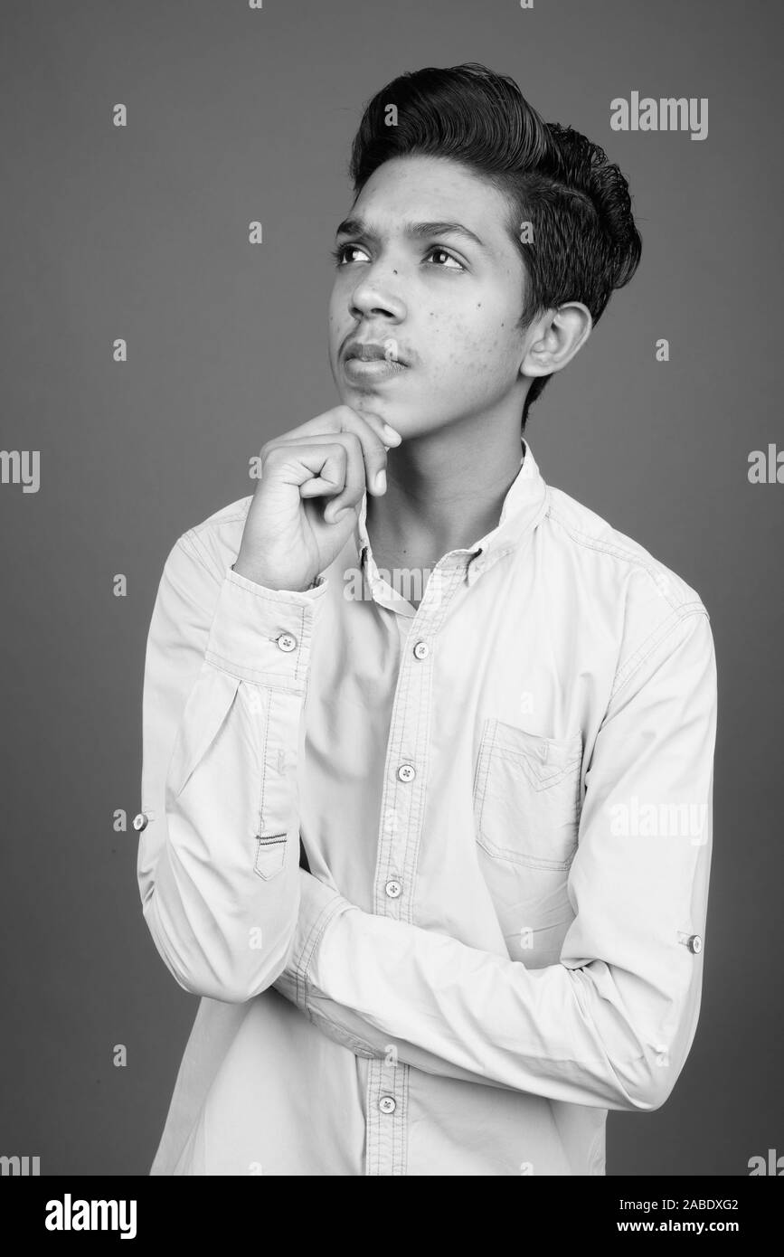 Young Indian boy looking smart in black and white Stock Photo - Alamy