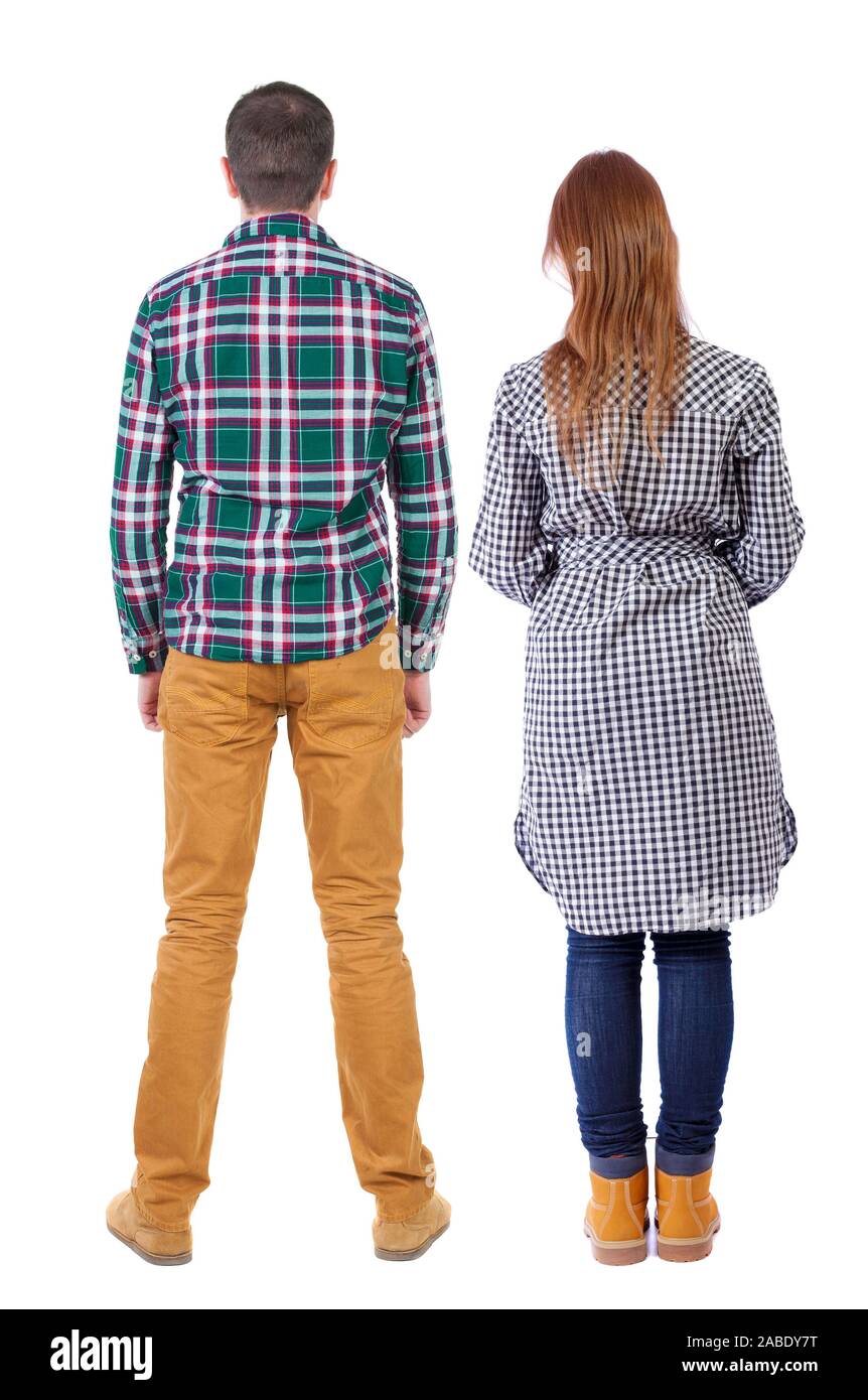 Back view of couple. beautiful friendly girl and guy together. Rear ...