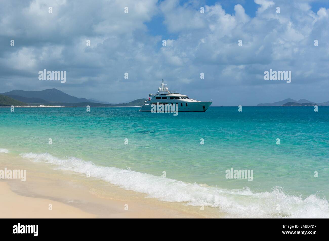Cruise boat, ship with tropical beach on foreground. Summer cruise ...