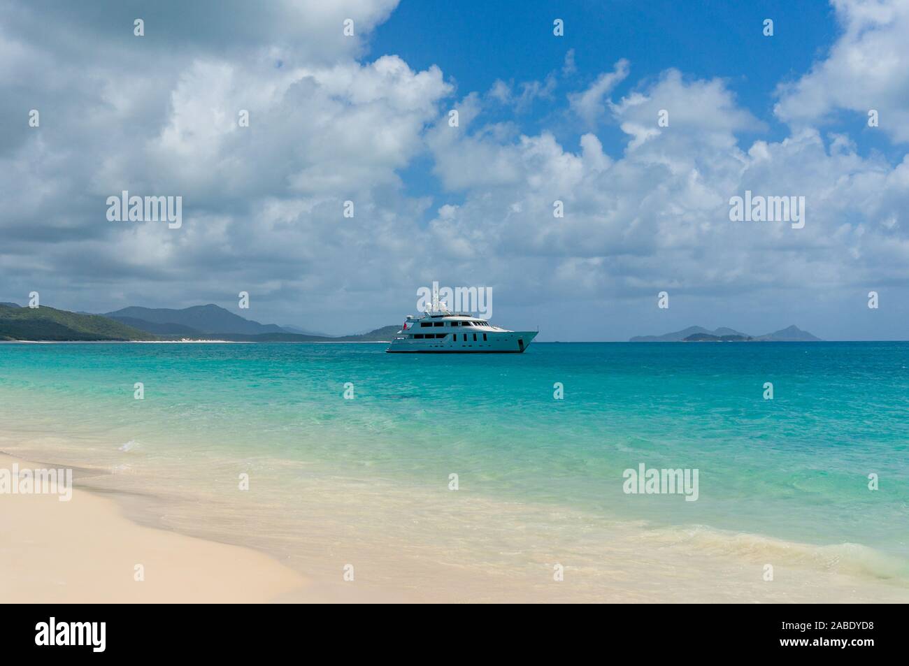 Cruise boat, ship with tropical beach on foreground. Summer cruise ...