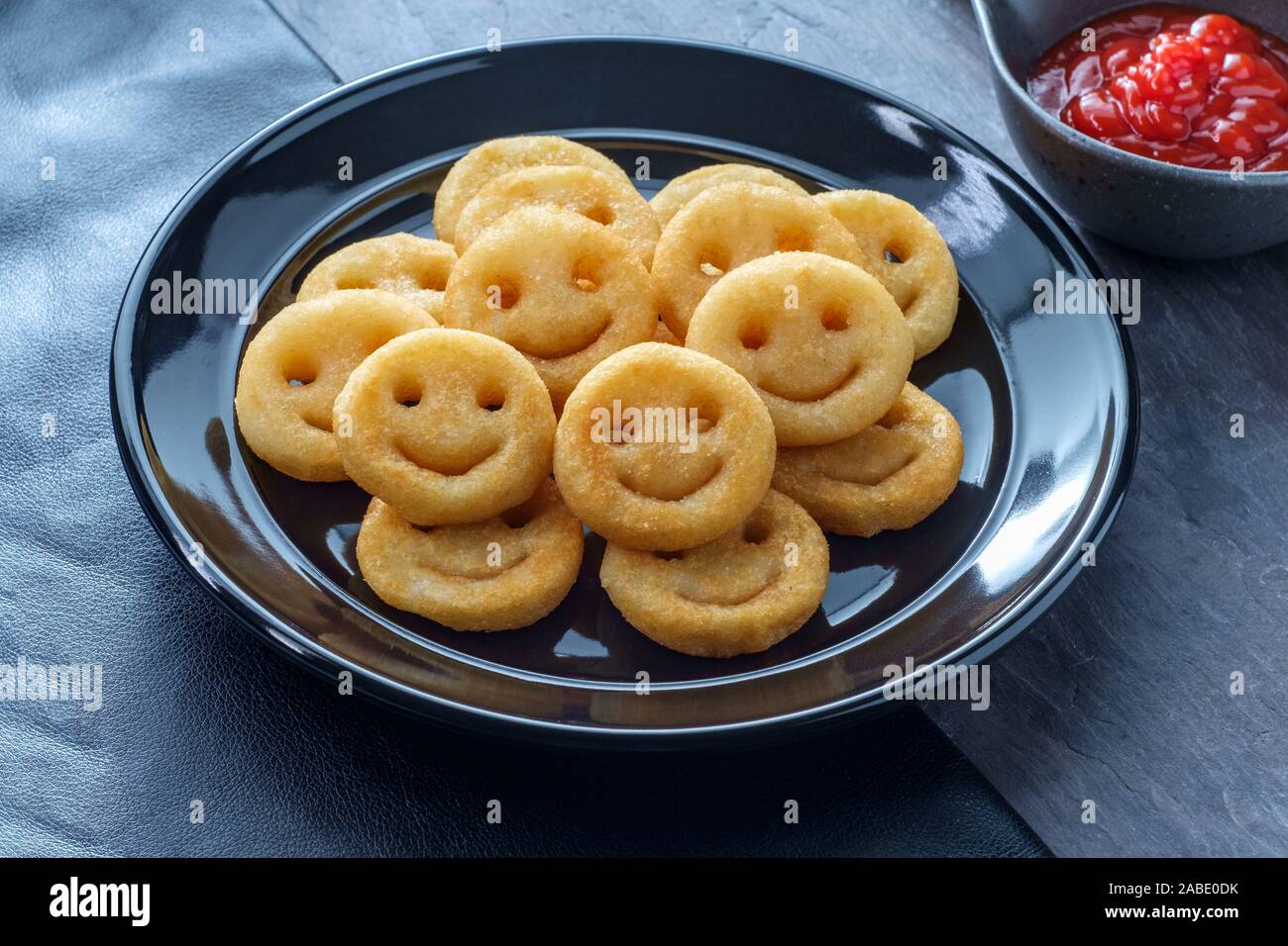 Happy French fried potato smiley faces with ketchup Stock Photo - Alamy