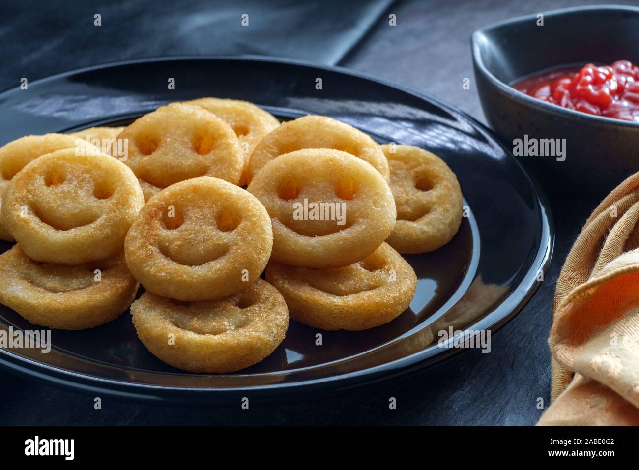 Happy French fried potato smiley faces with ketchup Stock Photo - Alamy