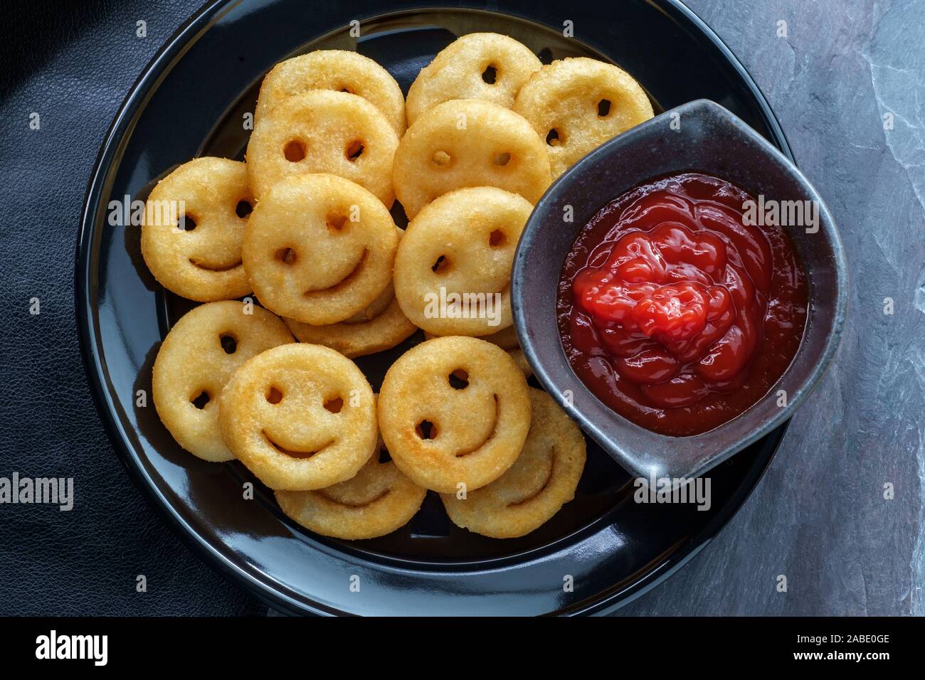 Happy French fried potato smiley faces with ketchup Stock Photo - Alamy