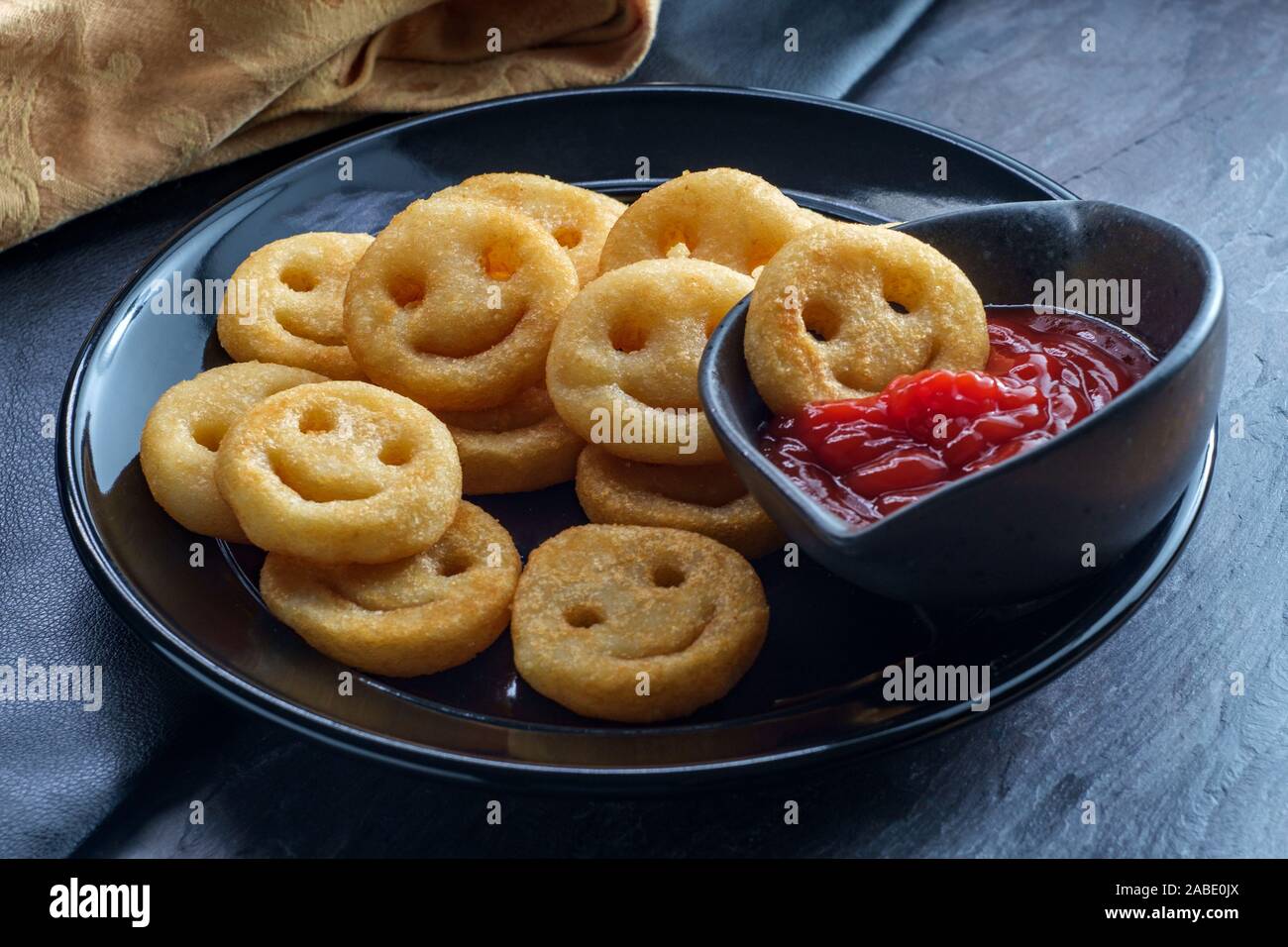 Happy French fried potato smiley faces with ketchup Stock Photo - Alamy