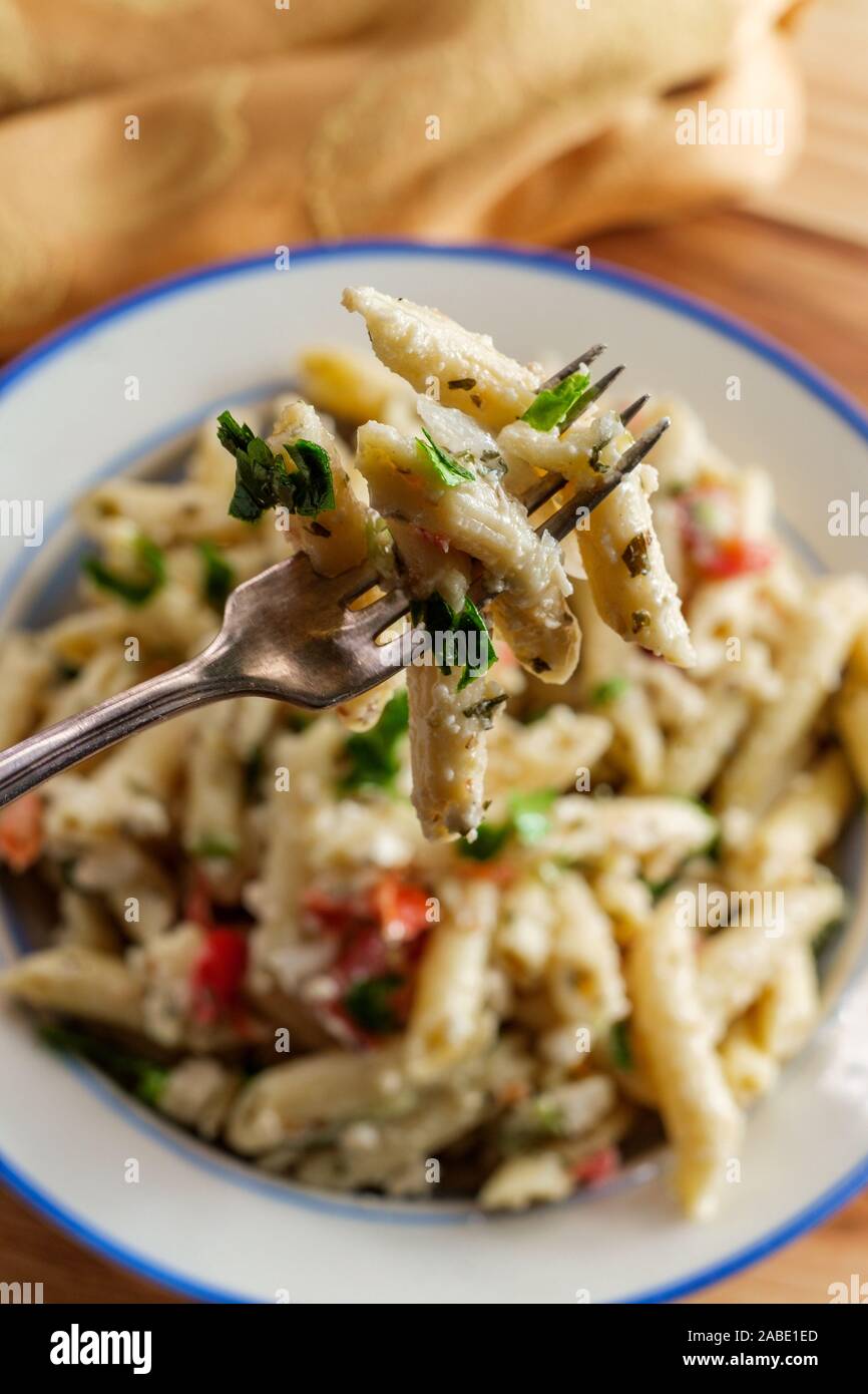 Greek penne Aegean pasta salad with crumbled feta cheese Stock Photo ...