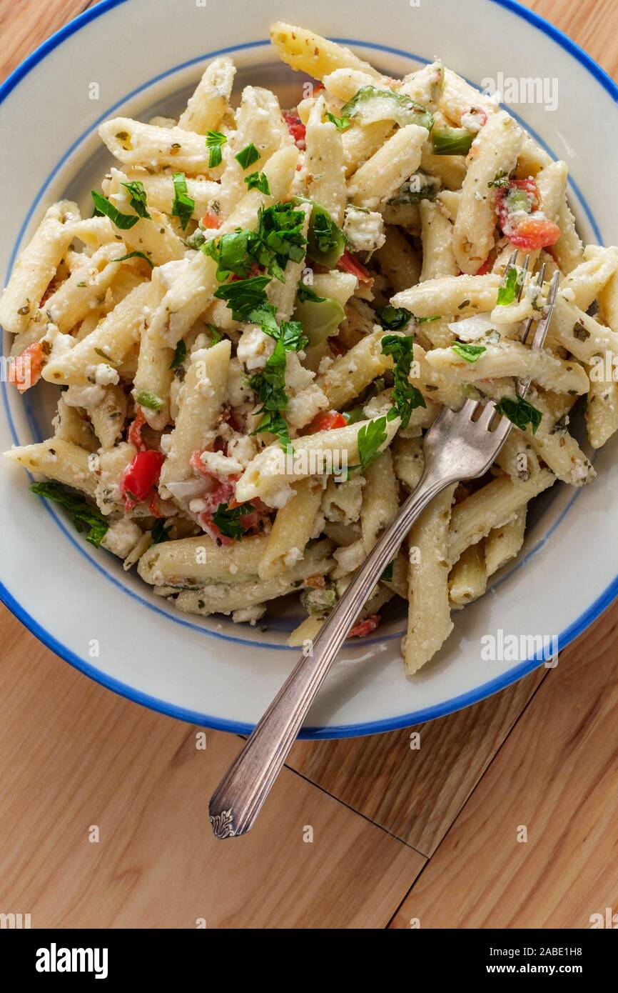 Greek penne Aegean pasta salad with crumbled feta cheese Stock Photo ...