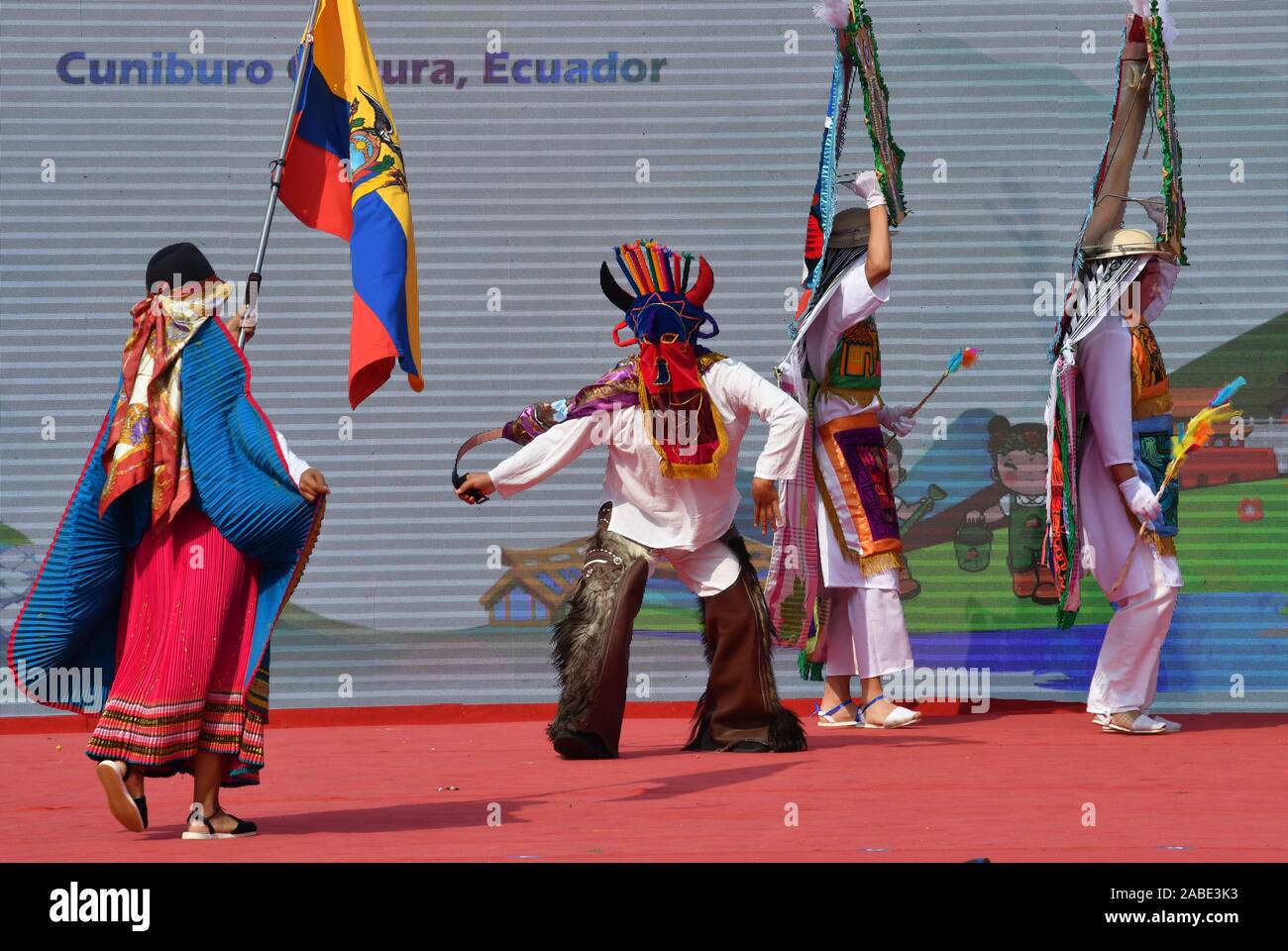 Ecuadorian artisits of Cuniburo Cultura dressed up in dance customes ...