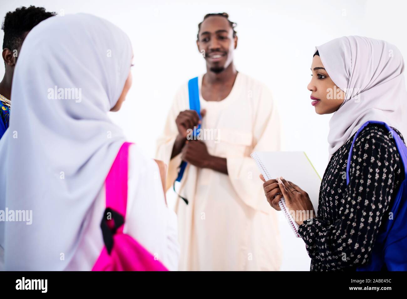 group of happy african students having conversation and team meeting ...