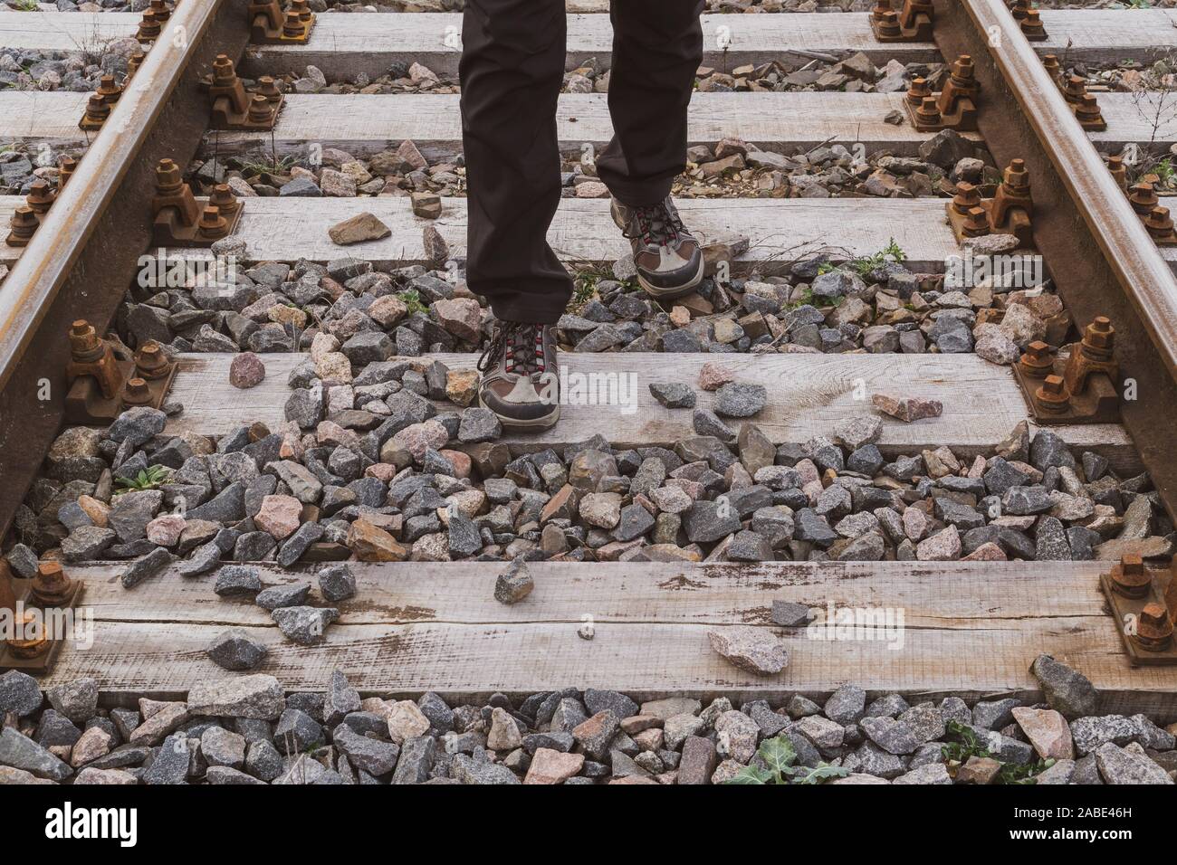 Man walking on the railway tracks, posing a threat to trains and ...