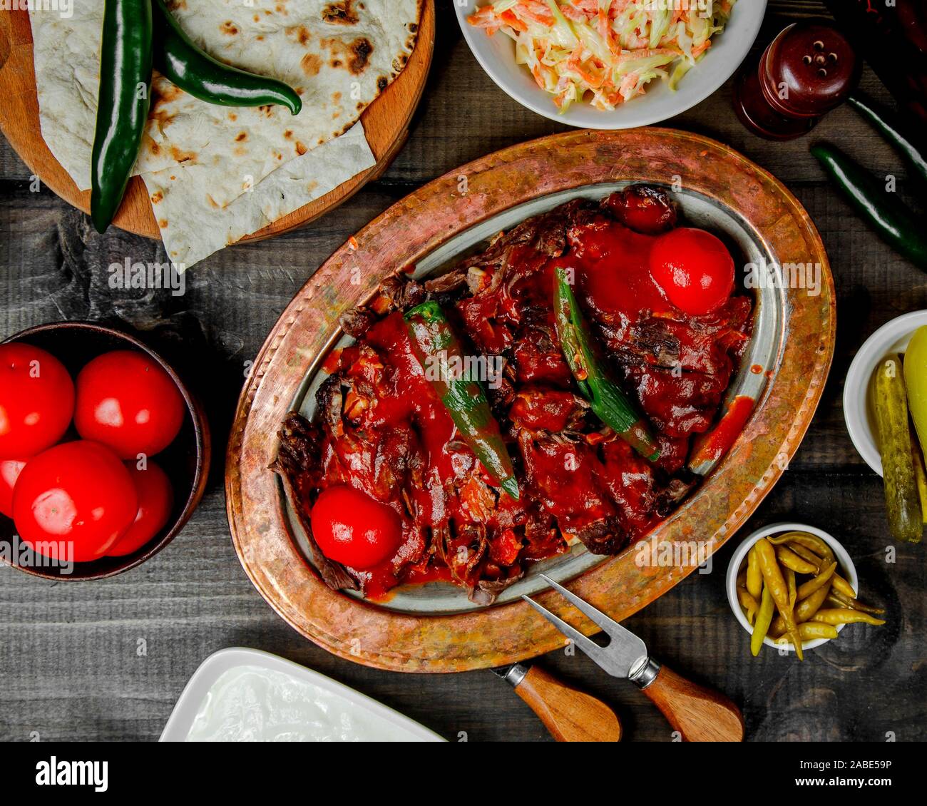top view of iskender kebab topped with pepper and tomato Stock Photo ...