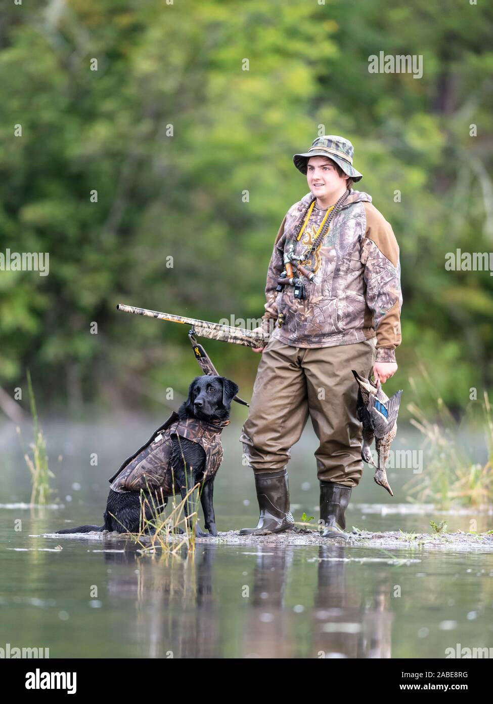 A Young Duck hunter and his hunting dog Stock Photo - Alamy