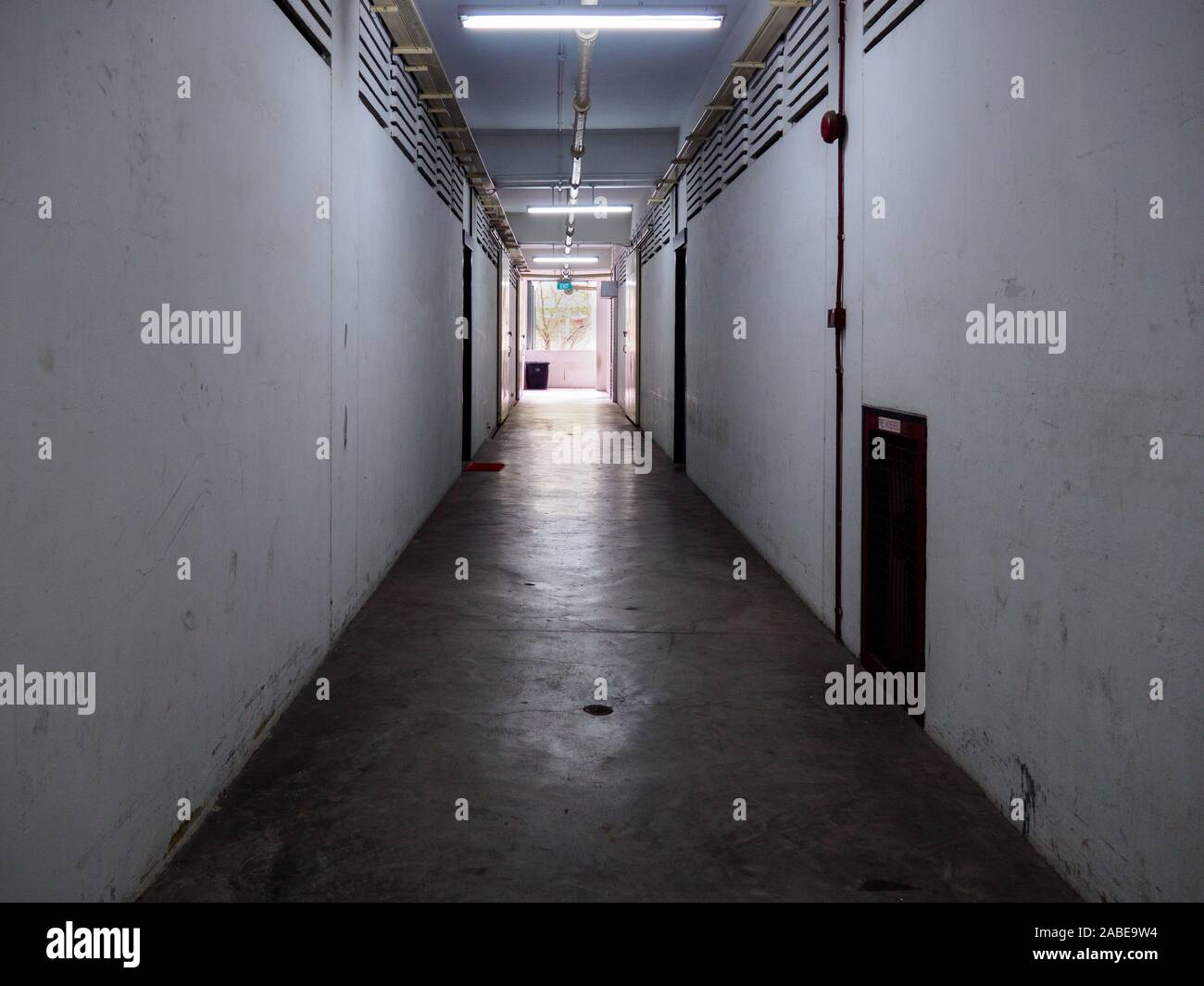 A long empty corridor / passageway in an old industrial building Stock ...