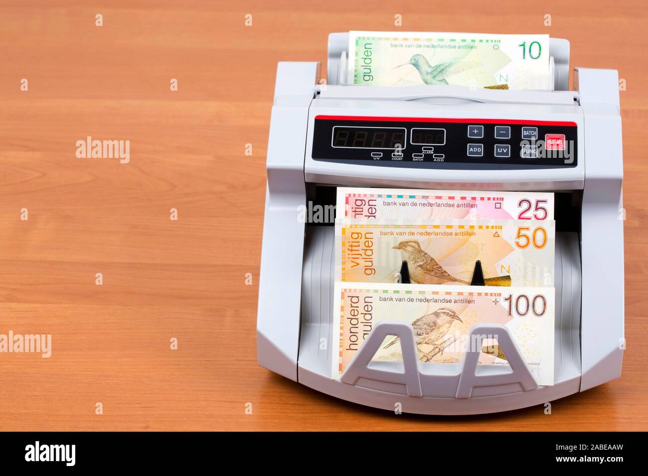 Netherlands Antillean money - Guilder in a counting machine Stock Photo ...