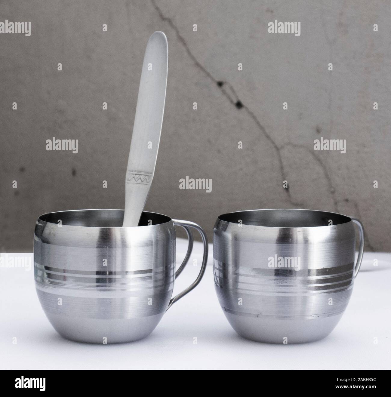 Vintage silver tow cup with spoon on black and white background Stock ...
