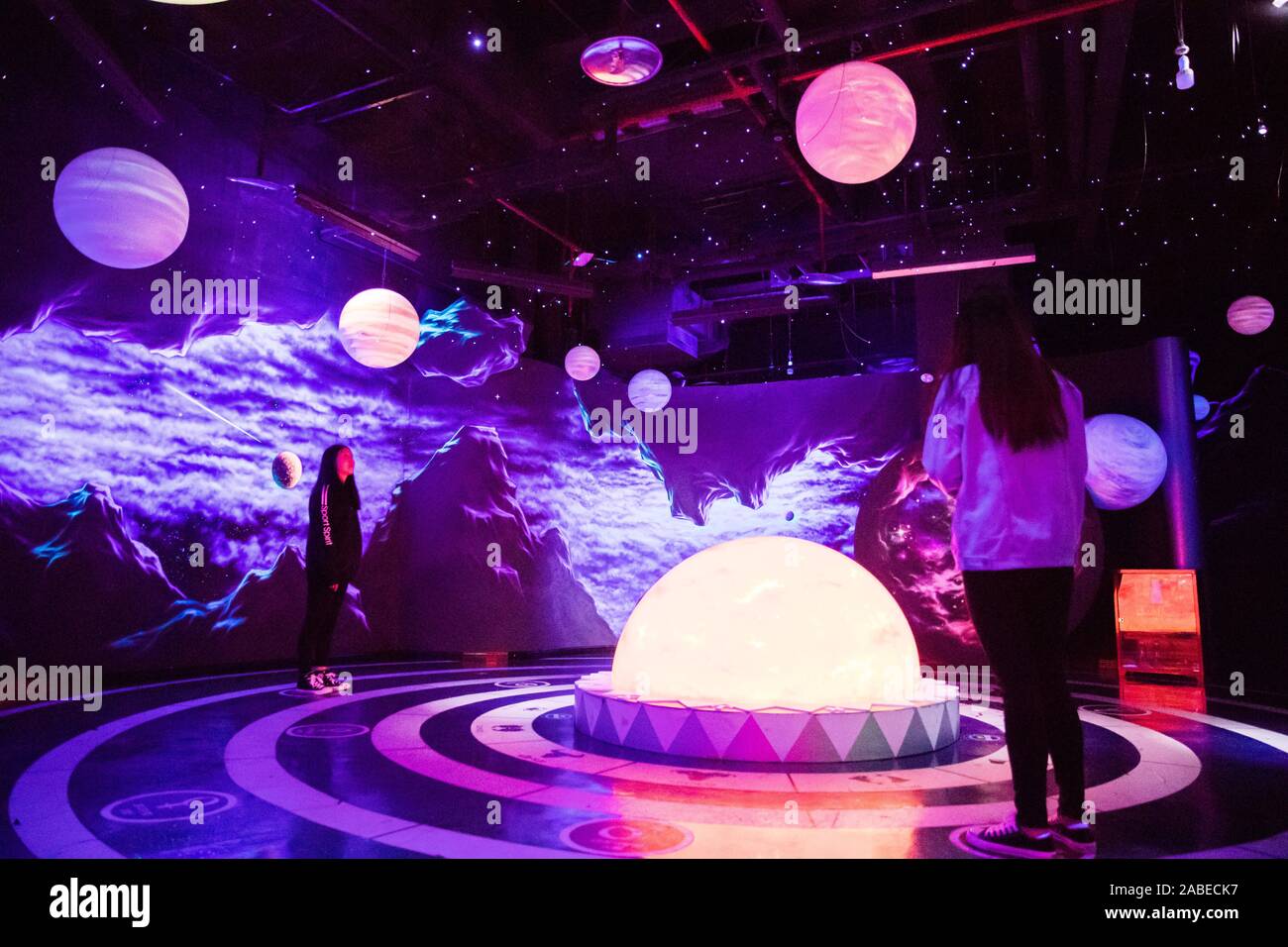 Tourists stroll and observe at a newly opened museum of constellation ...